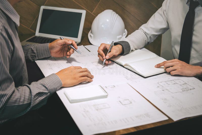 Team of Construction Engineering or Architect Partner Discuss a ...