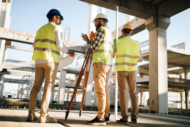 Team of Construction Engineers Working on Building Site Stock Photo ... Team of Construction Engineers Working on Building Site Stock Photo ...