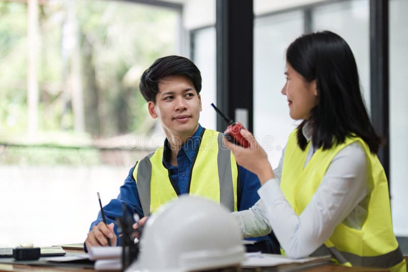 A Team of Construction Engineers Works in an Office on a Construction ...