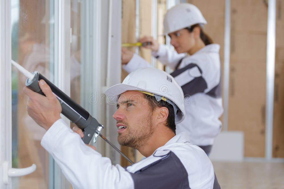 Team Construction Workers Installing Window in House Stock Image ...