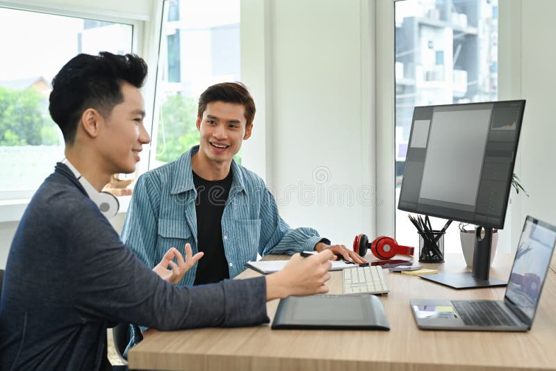 Team of Content Creator Working Together, Editing Video Footage with ...