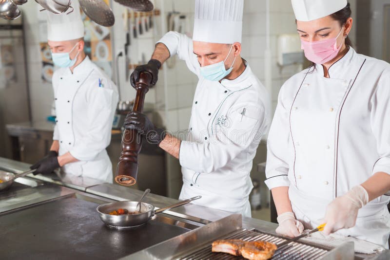 Team of Cooks Cooks in a Restaurant Stock Photo - Image of cook ...