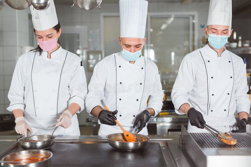 Team of Cooks Cooks in a Restaurant Stock Photo - Image of chefs ...