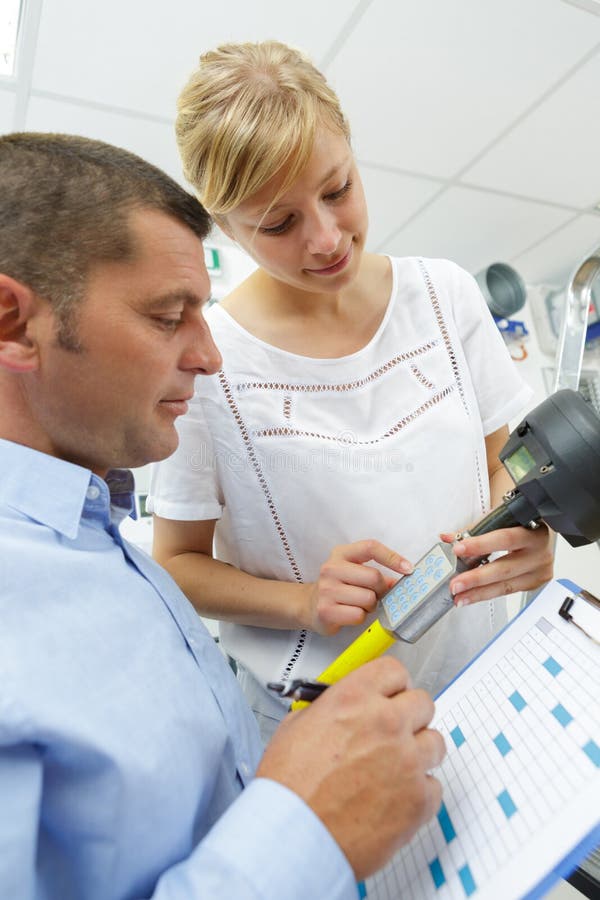Team Coworkers Testing Oxygen Tank Stock Image - Image of metal, tool ...