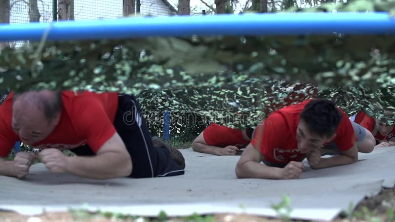 Team Crawling through Obstacle Course Stock Footage - Video of activity ...