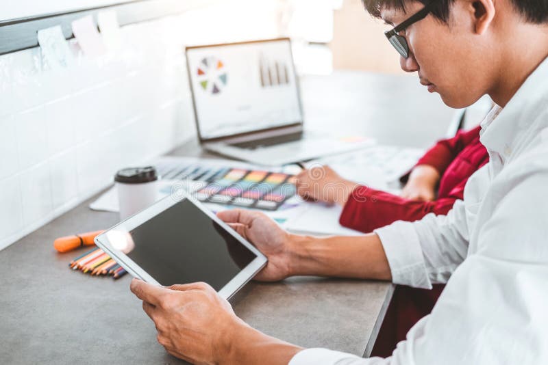 Team Creative Business Using Tablet Planning and Thinking of New Ideas ...