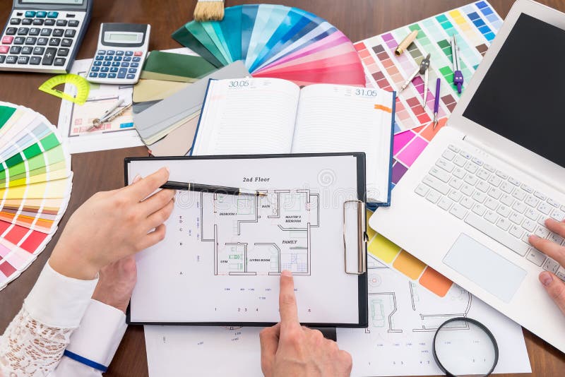 Team of Creative Designers Discussing House Plan in Office Stock Image ...