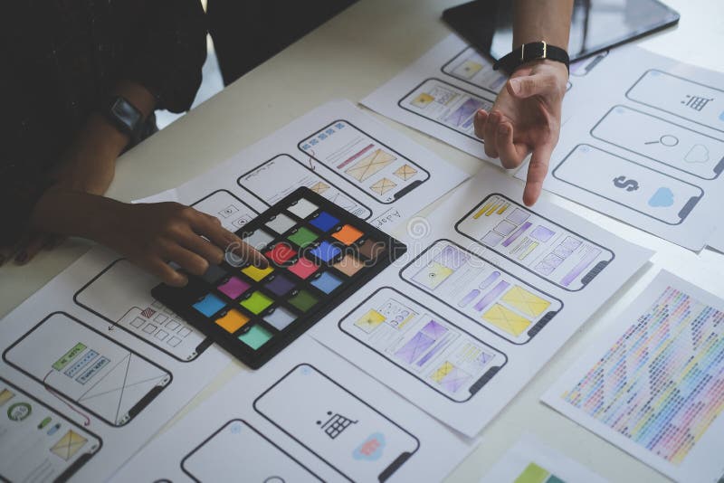 Team of Creative Designers Working and Planning Application Layout ... Team of Creative Designers Working and Planning Application Layout ...