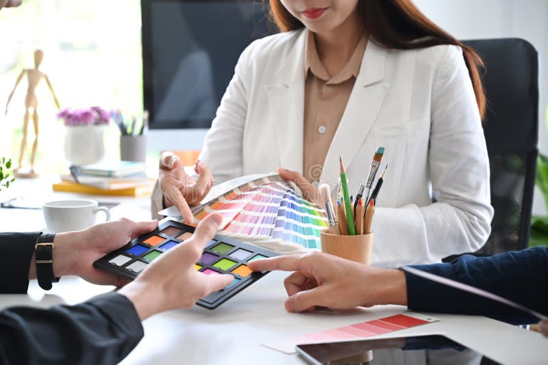 Team of Creative Designers Working on Project Together in a Design ...