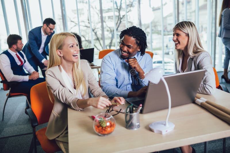 Creative People Looking at Colleague Showing Project Plan on His Laptop ...