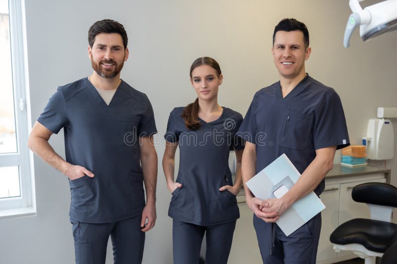 Team of Dentists Posing in Dentistry Stock Photo - Image of indoors ...
