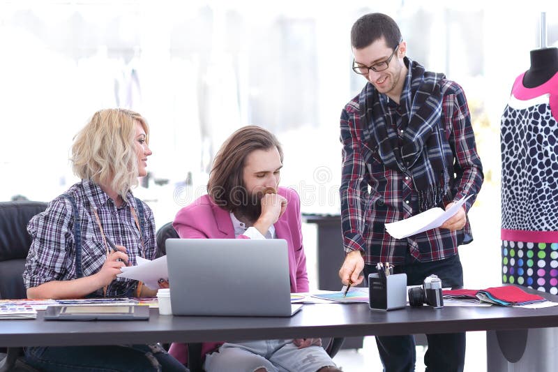 Team of Designers Discussing New Ideas in the Studio Stock Photo ...
