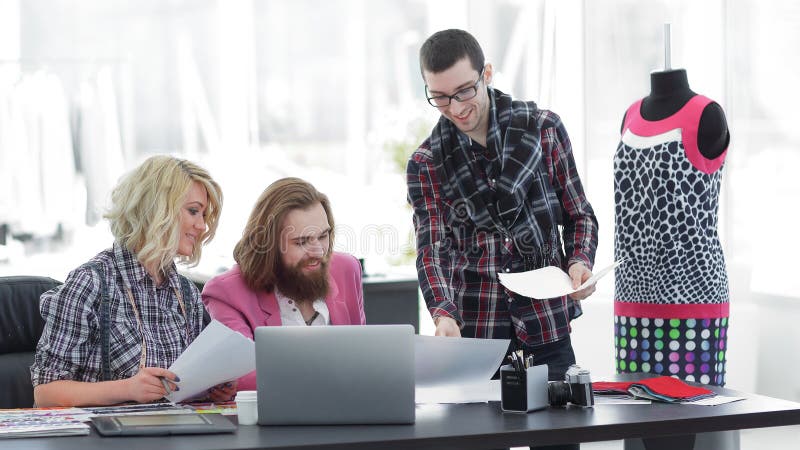 Team of Designers Discussing New Ideas in the Studio Stock Photo ...