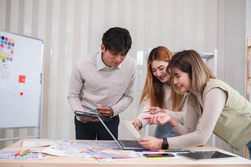 A Team of Designers Helps Develop the Application System. Brainstorm ...