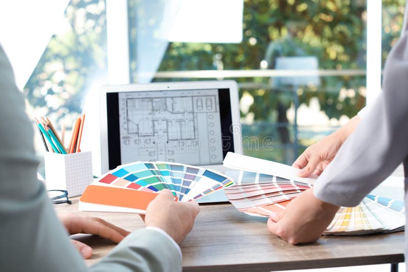 Team of Designers Working with Color Palettes at Office Table Stock ...