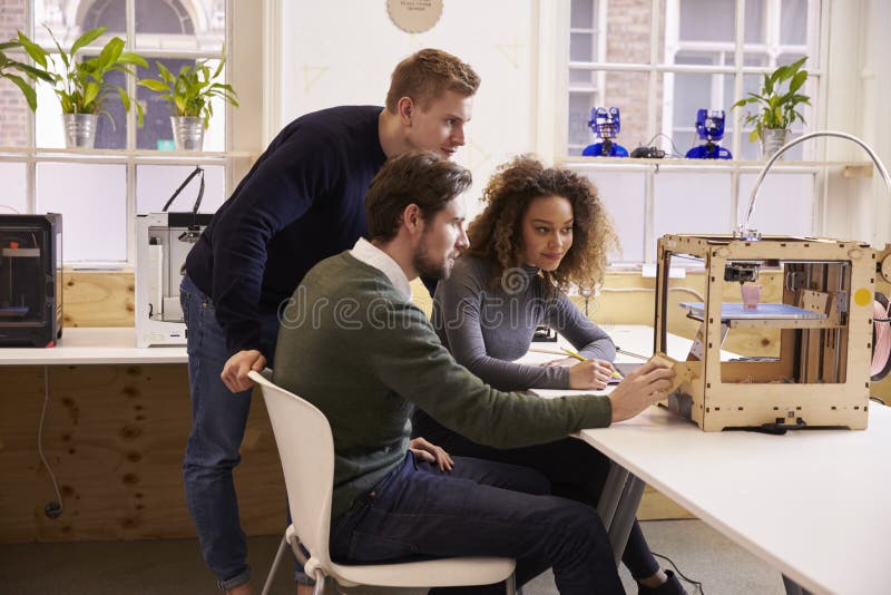 Team of Designers Working with 3D Printer in Design Studio Stock Photo ...