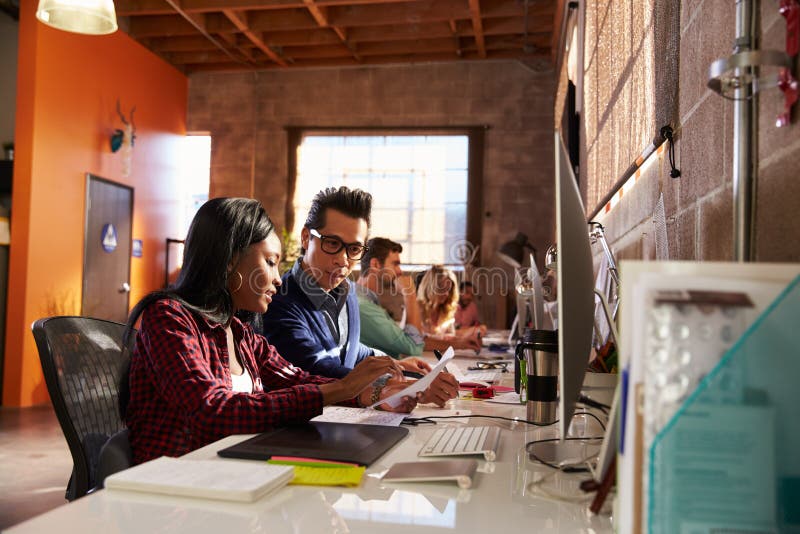 Team of Designers Working at Desks in Modern Office Stock Photo - Image ...