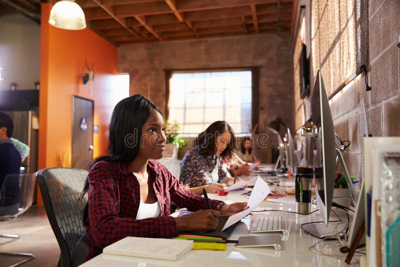 Team of Designers Working at Desks in Modern Office Stock Image - Image ...
