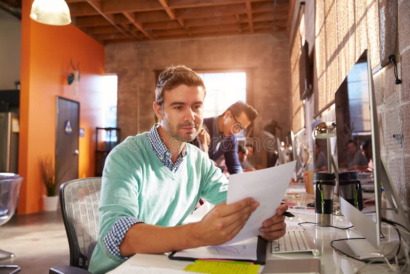 Team of Designers Working at Desks in Modern Office Stock Image - Image ...