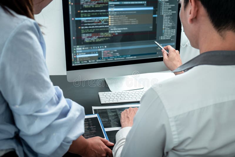 Team Of Developer Programmer Working On Coding Program Software Computer In Office Writing