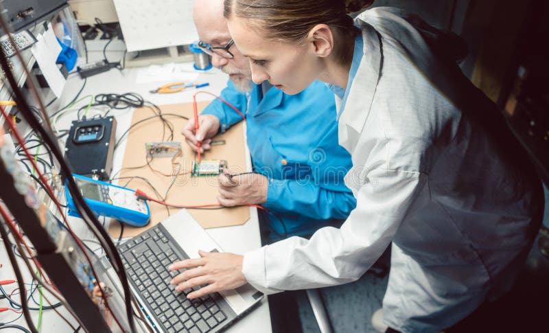 Team of Development Engineers Designing New Product in the Lab Stock ...