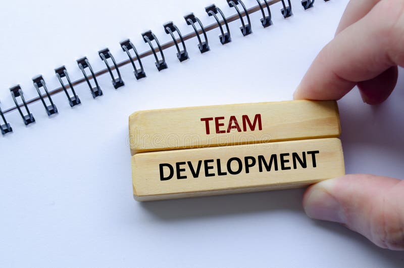 TEAM DEVELOPMENT Text on Wooden Blocks, Strategic Planning and ...