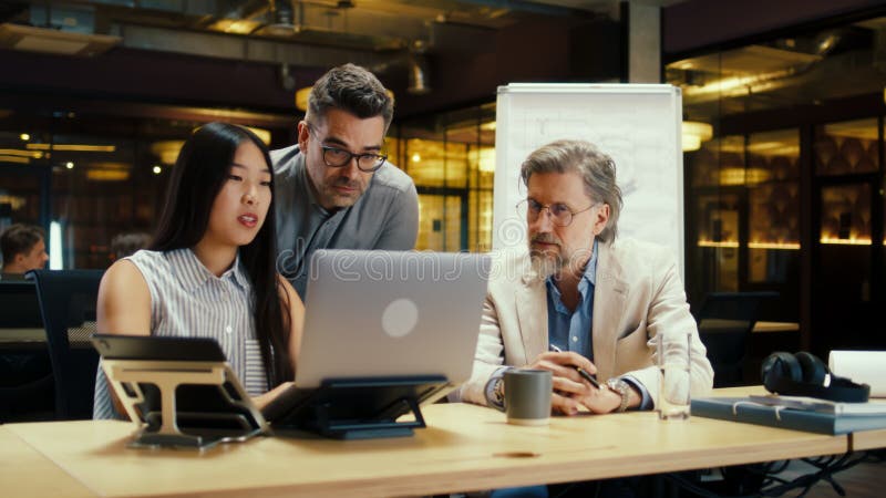 Team Discussing Business Strategy in Office Stock Photo - Image of ...