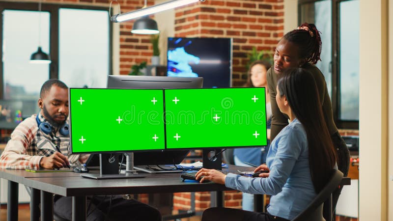 Team of Diverse Workers Analyzing Computers with Greenscreen Template ...