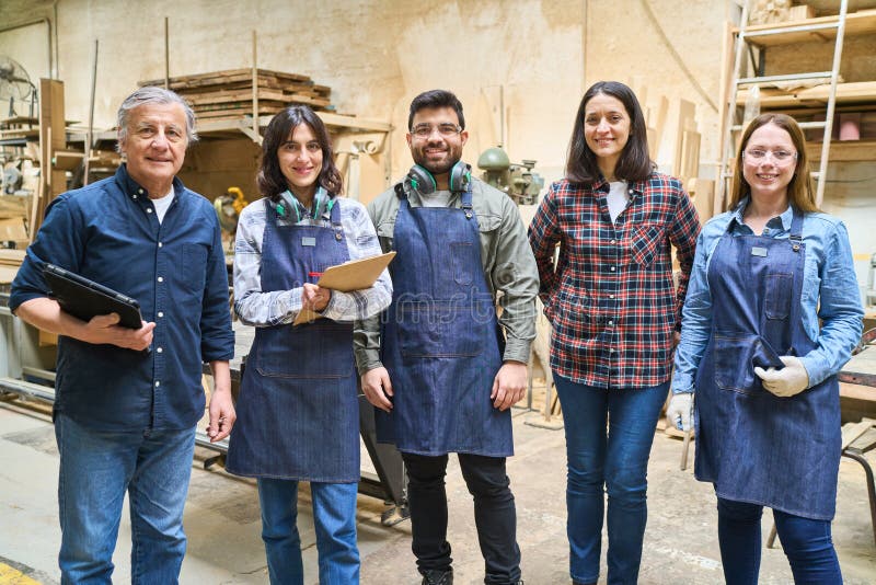 Team of Diverse Workers in a Collaborative Lumberyard Environment Stock ...