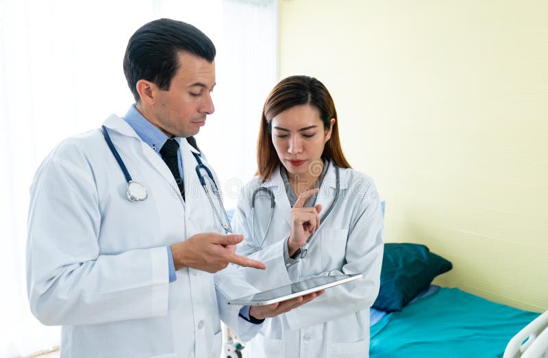 Team Doctors Examining Reports Stock Photos - Free & Royalty-Free Stock ... Team Doctors Examining Reports Stock Photos - Free & Royalty-Free Stock ...