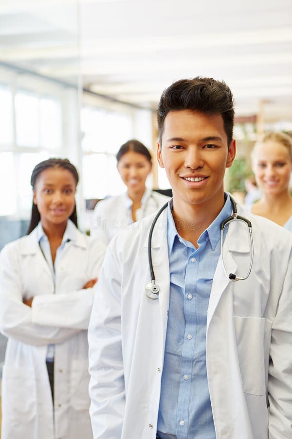 Doctors: Asian-American Physician with Others Stock Image - Image of ...
