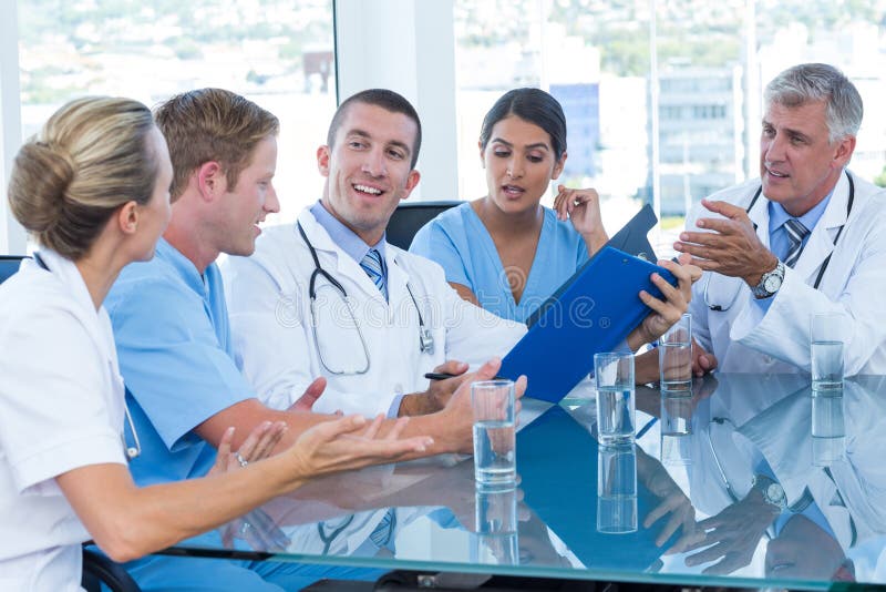 Team of Doctors Discussing about File Stock Image - Image of expertise ...
