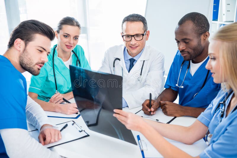 Team of Doctors Discussing X-ray Scan Stock Photo - Image of doctors ...