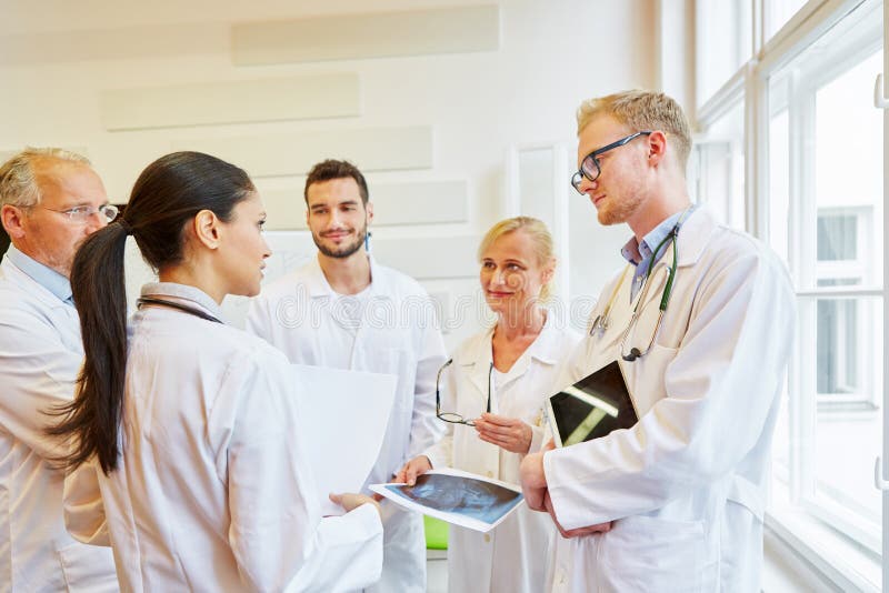 Team of Doctors in Discussion Stock Photo - Image of hospital, medicine ...