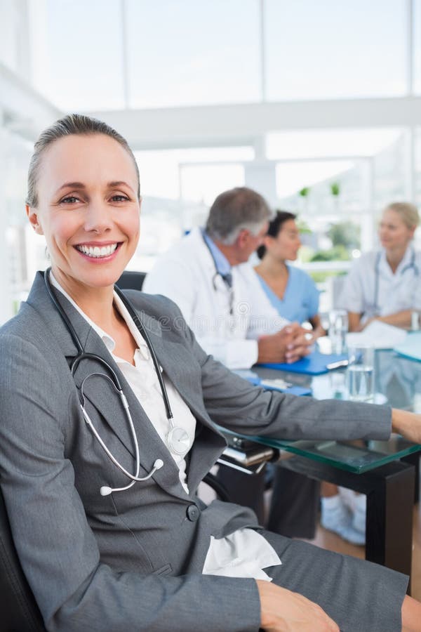 Team of Doctors Having a Meeting Stock Photo - Image of clinic, desk ...