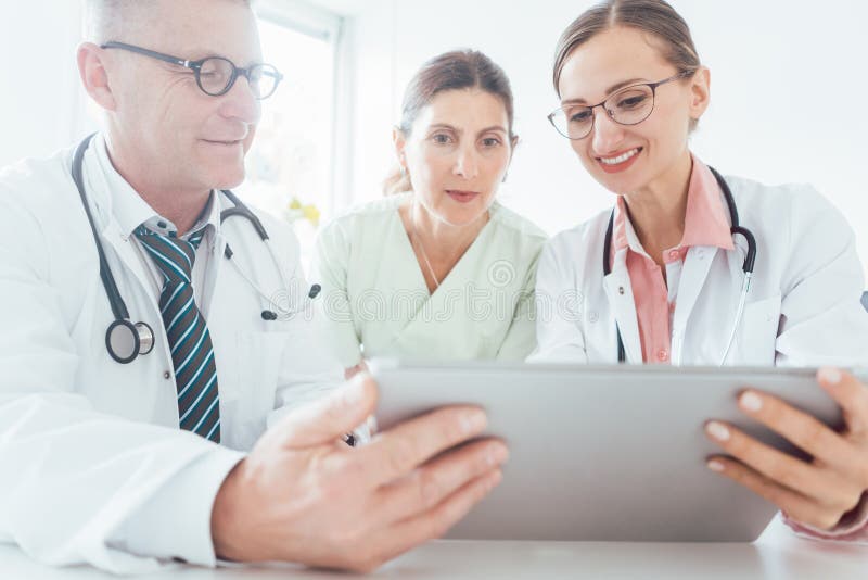 Two Doctors Discussion Documents or Test Results Stock Image - Image of ...