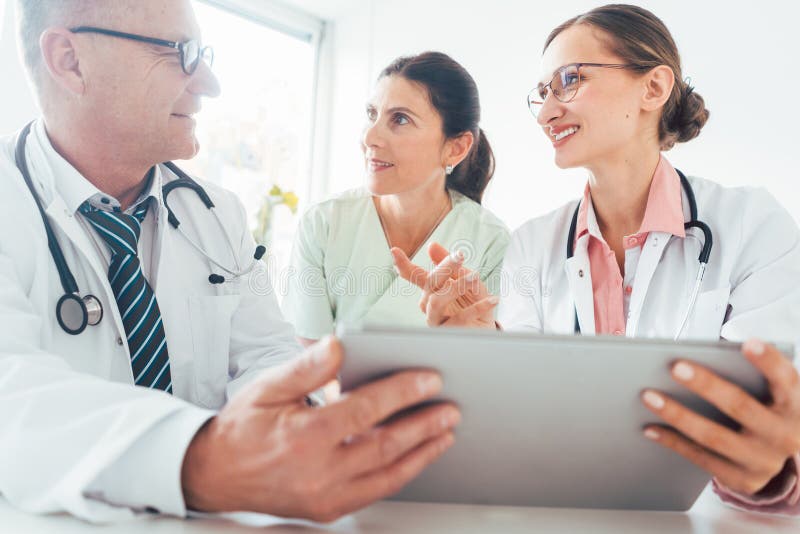 Two Doctors Discussion Documents or Test Results Stock Image - Image of ...