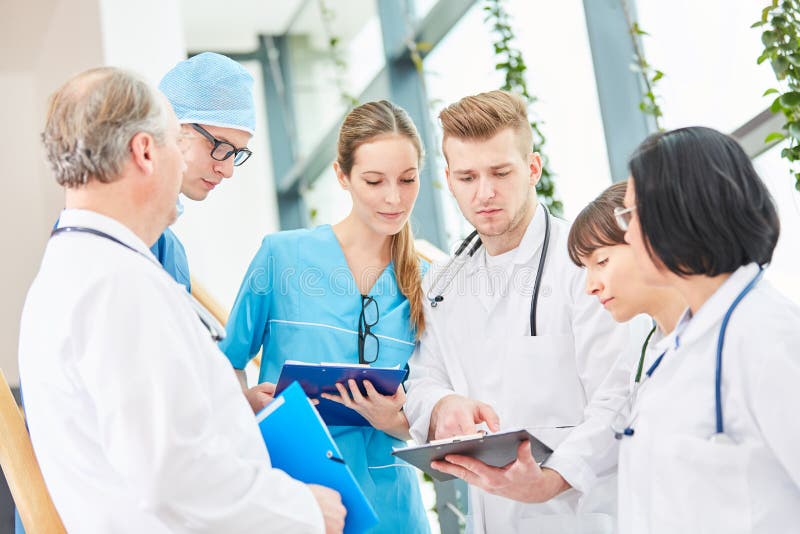 Team of Doctors Planning Surgery Stock Image - Image of surgeon ...