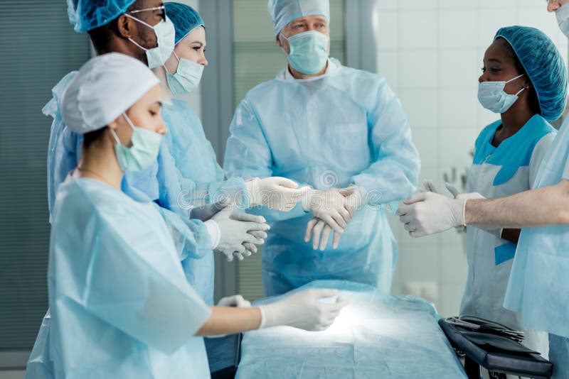 Team of Doctors Preparing for Surgery Stock Image - Image of cheerful ...