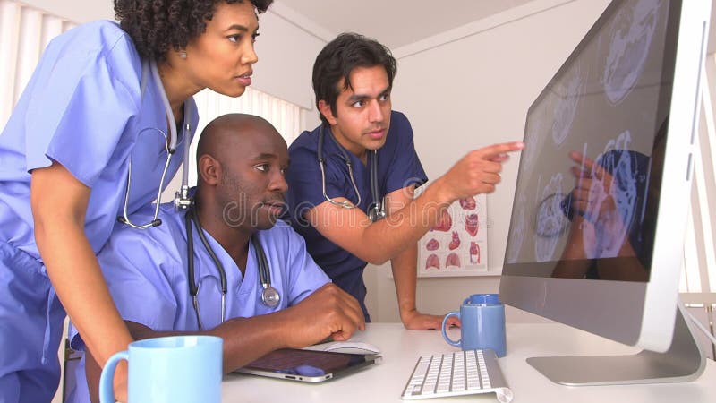 Team of Doctors Reviewing Work on Computer Stock Video - Video of ...
