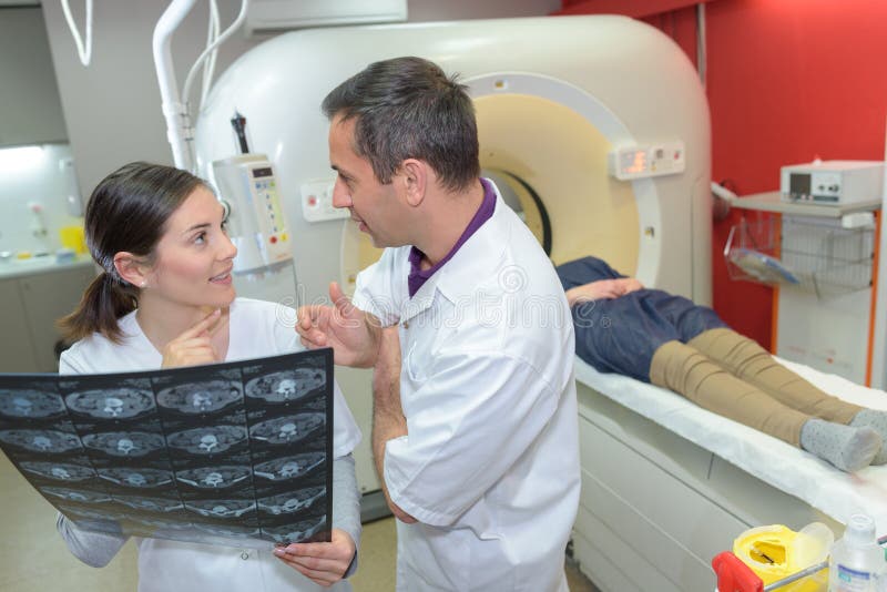 Two Doctors Talking To Each Other in Hospital Stock Photo - Image of ...