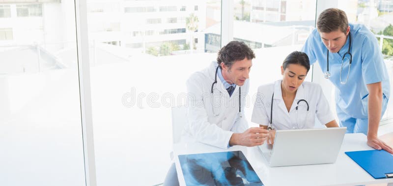 Team of Doctors Working on Laptop Computer Stock Photo - Image of ...