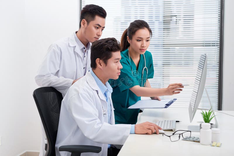 Team of Doctors Working Together Stock Image - Image of hospital ...