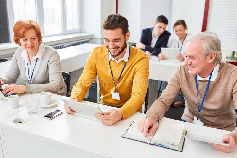 Team in e-learning seminar stock image. Image of senior - 98934895