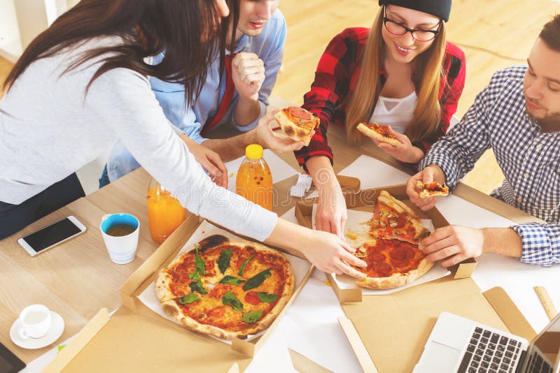Team Eating Pizza at Workplace Stock Photo - Image of desktop ...