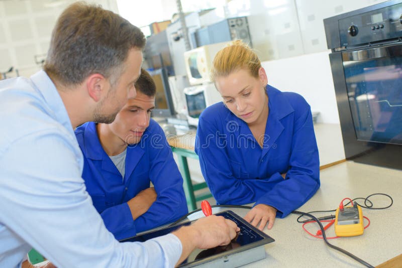 Team Electrical Apprentices with Teacher Stock Photo - Image of ...
