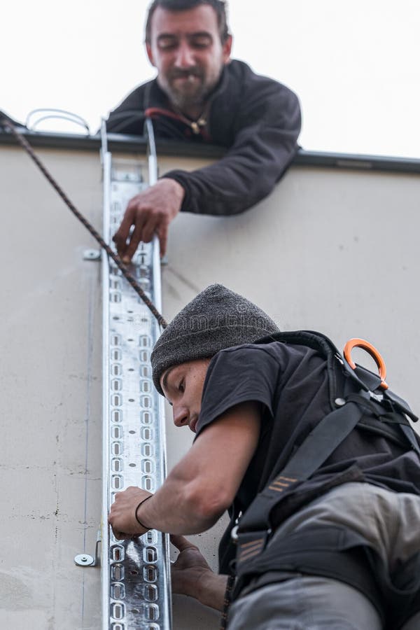 Team of Electrical Engineers Install the Electrical Cables for the ...