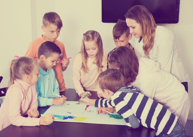 Team of Elementary Age Children Drawing Stock Photo - Image of ...