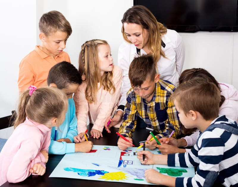 Team of Elementary Age Children Drawing Stock Photo - Image of ...