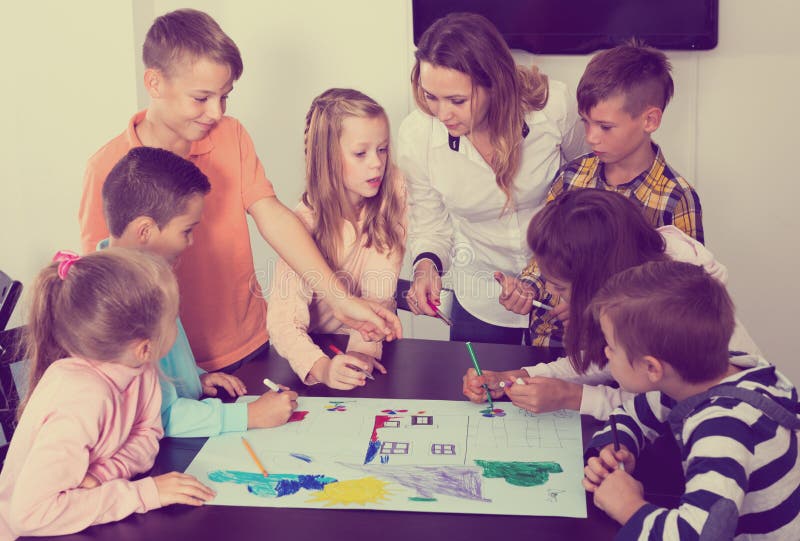 Team of Elementary Age Children Drawing Stock Photo - Image of ...